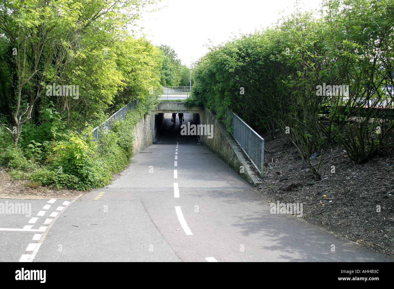 An underpass with two figures in the distance Stock Photo - Alamy