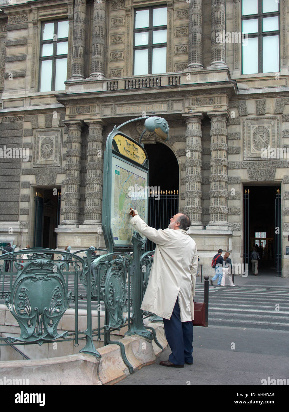 Man looks at Metro map at the Musee du Louvre subway entrance Paris ...