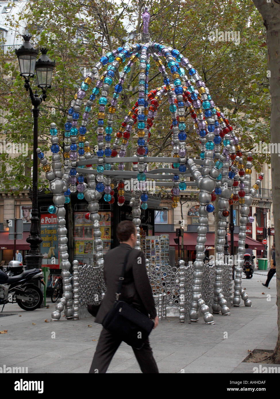Man walking to the Palais Royal Musee du Louvre Metro subway entrance ...