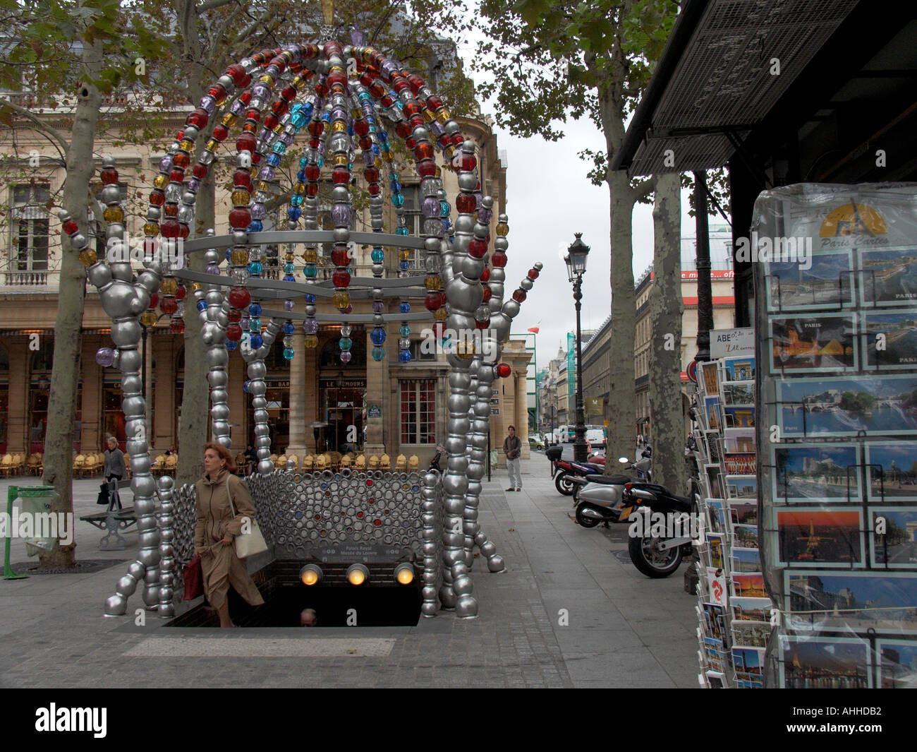 Woman leaves the Palais Royal Musee du Louvre Metro subway entrance ...