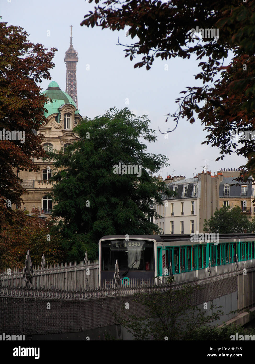 Metro train near Pasteur station with Eiffel Tower in background Paris ...