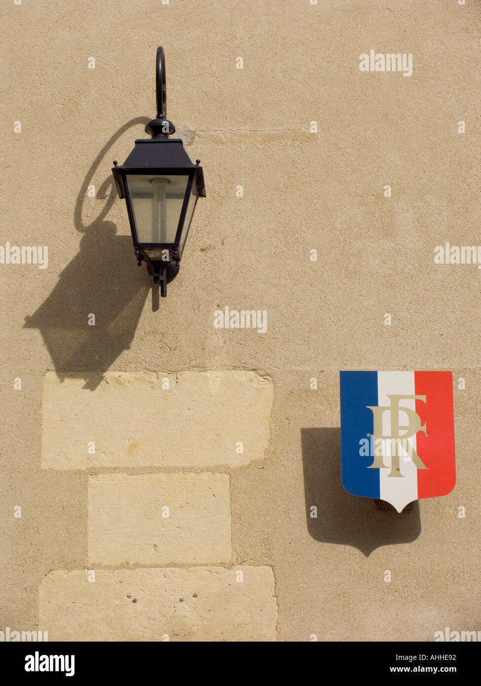 French Tri color shield and light on facade of Les Invalides ...