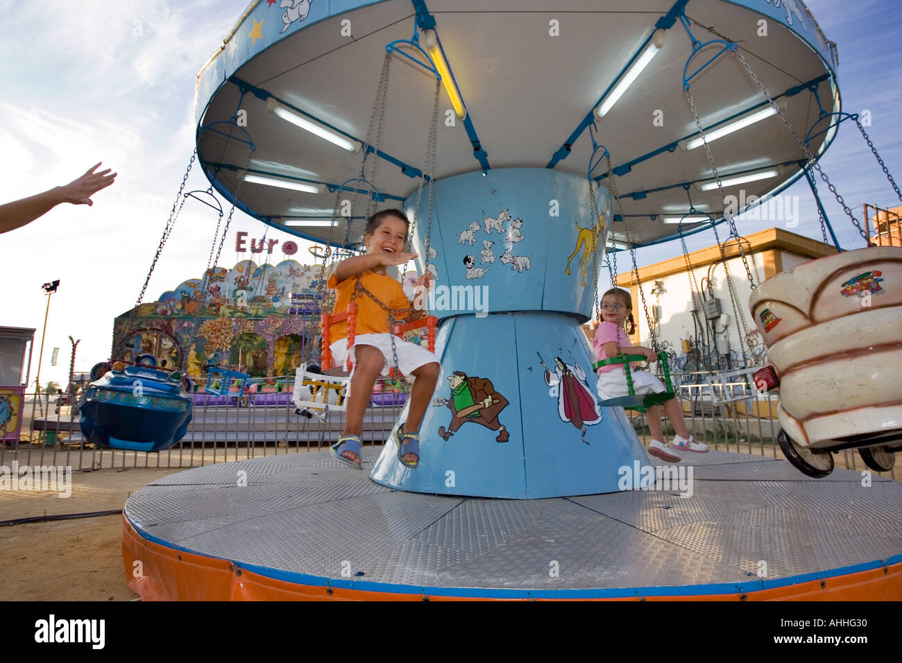 Children enjoying a carousel, Spain Stock Photo - Alamy