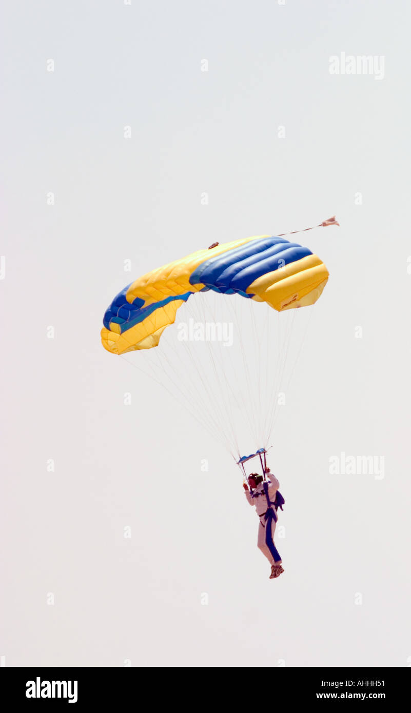 skydiver with colourful parachute in sky Stock Photo - Alamy