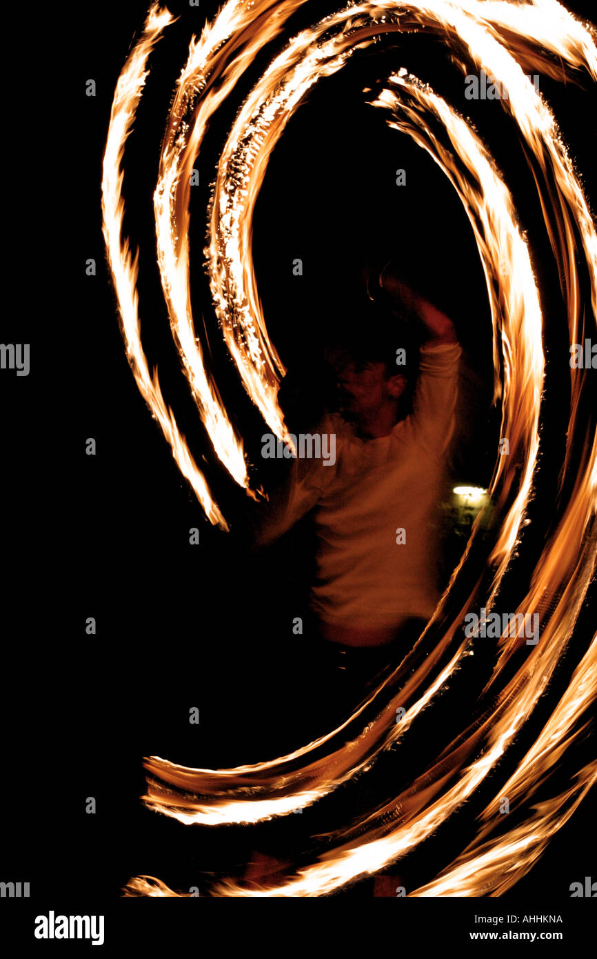 A person performiing the art of fire poi Stock Photo - Alamy