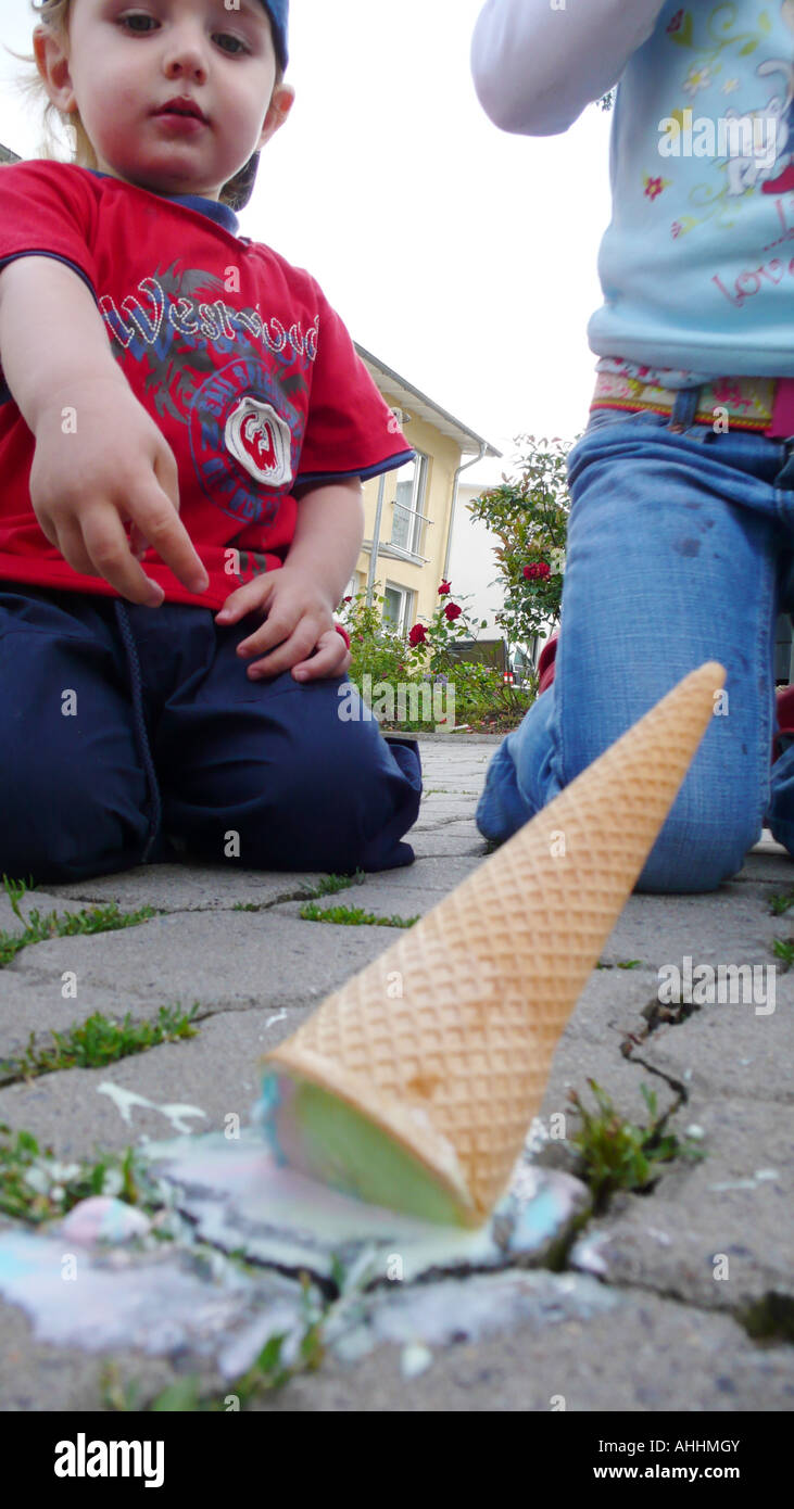 children with falling down ice-cream cone Stock Photo - Alamy