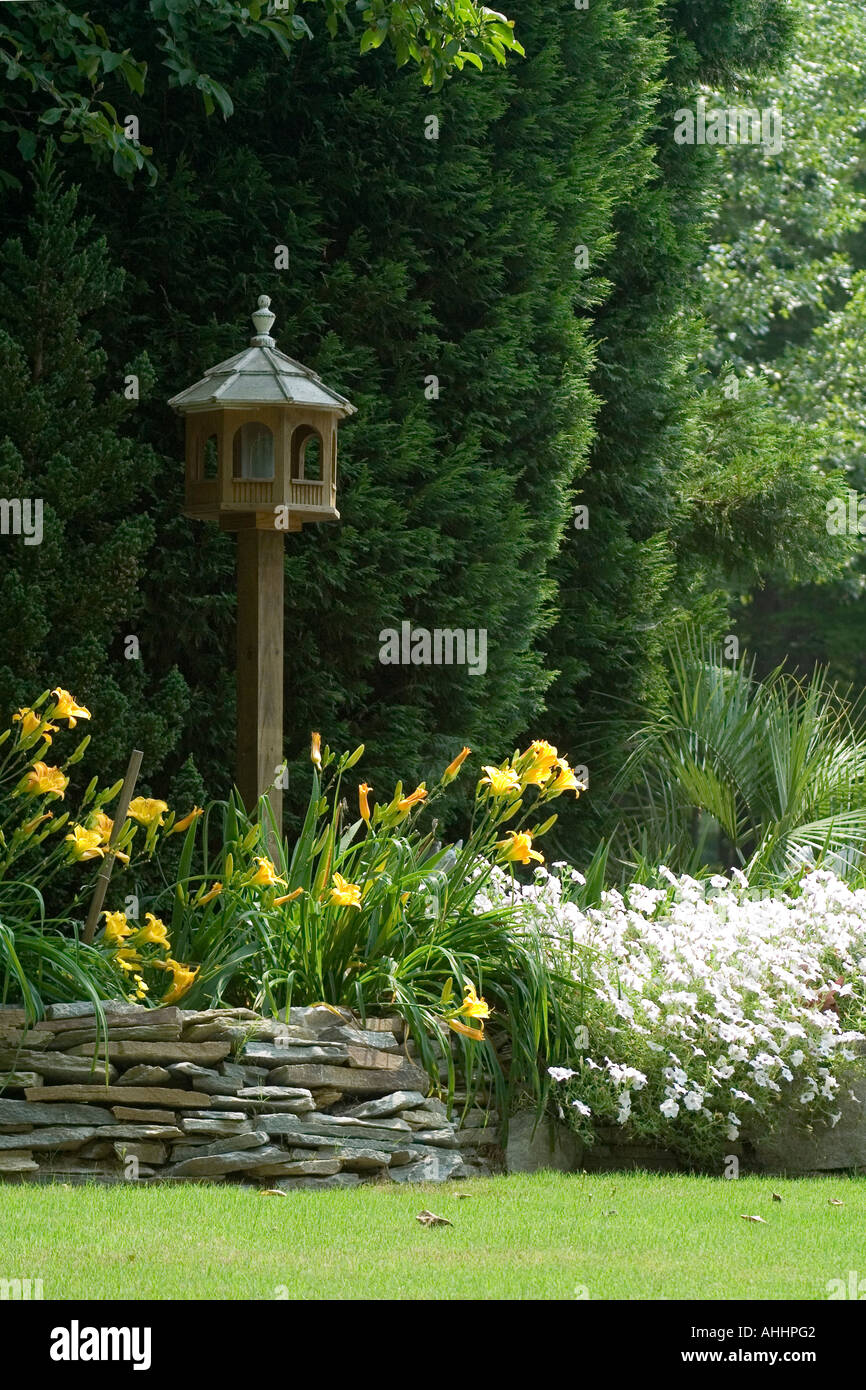 Landscaped garden with birdhouse Stock Photo - Alamy