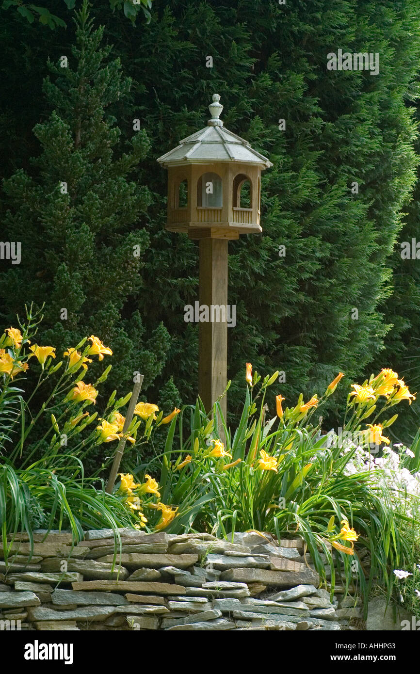 Landscaped garden with birdhouse Stock Photo - Alamy