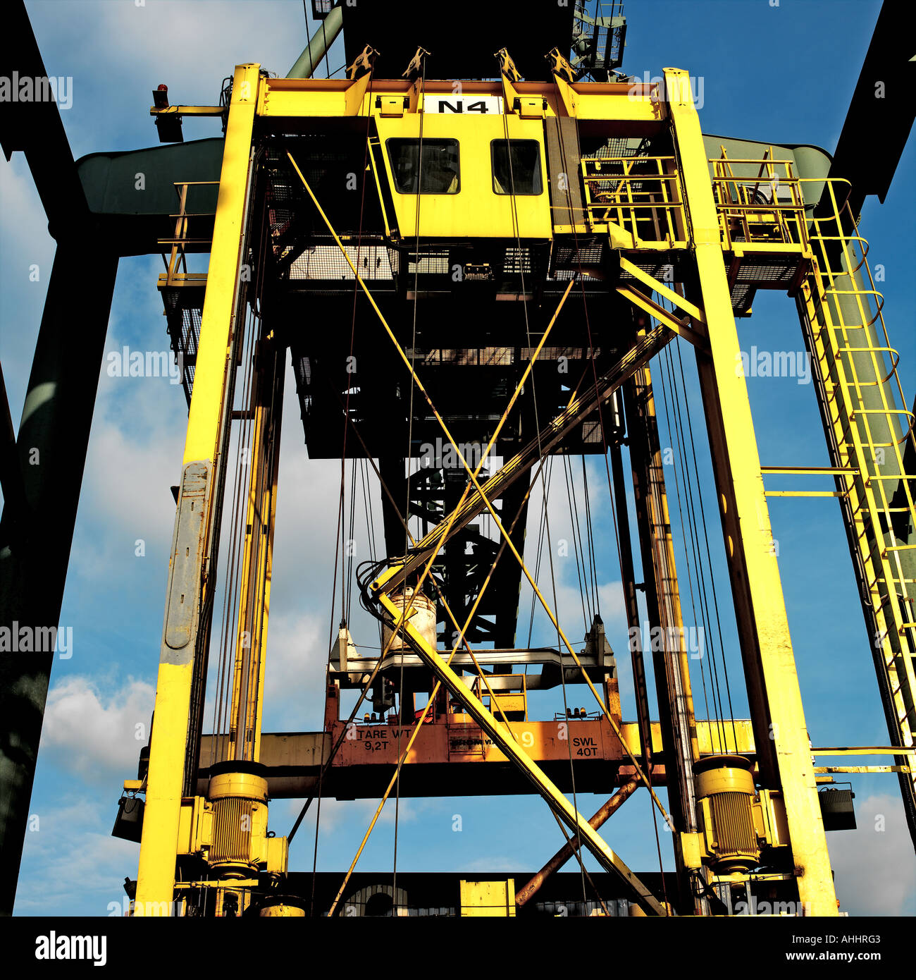 shipping and logistics straddle carrier close-up Stock Photo - Alamy