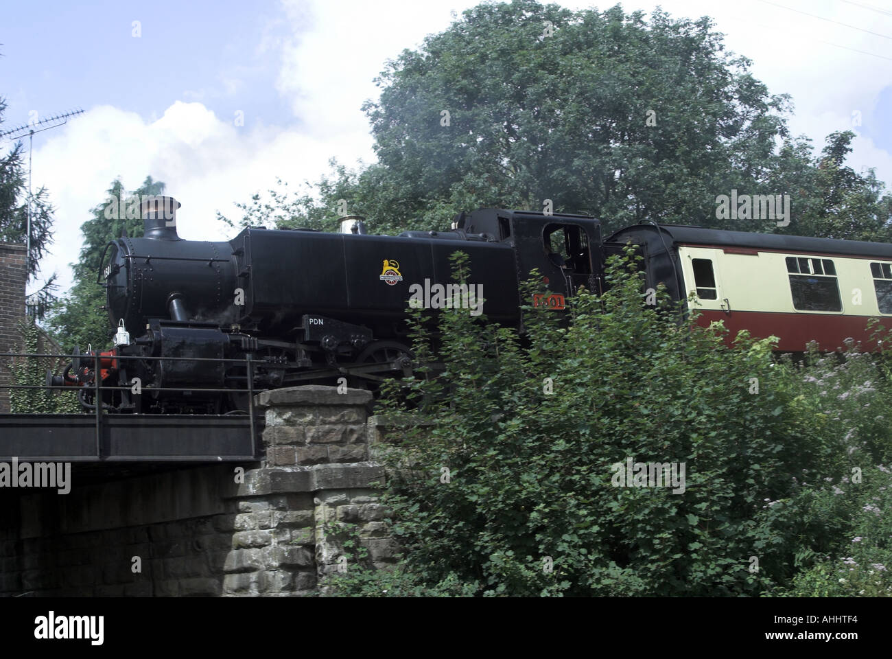 Steam train crossing bridge as it enters Hampton Loade Station Severn ...