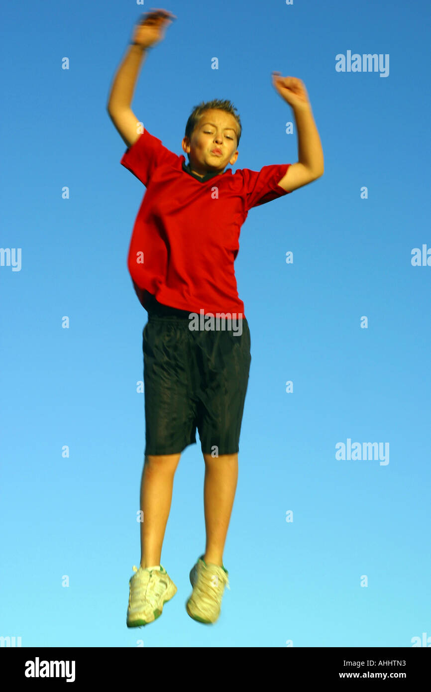 Young boy jumping into the air or falling from the air Stock Photo - Alamy