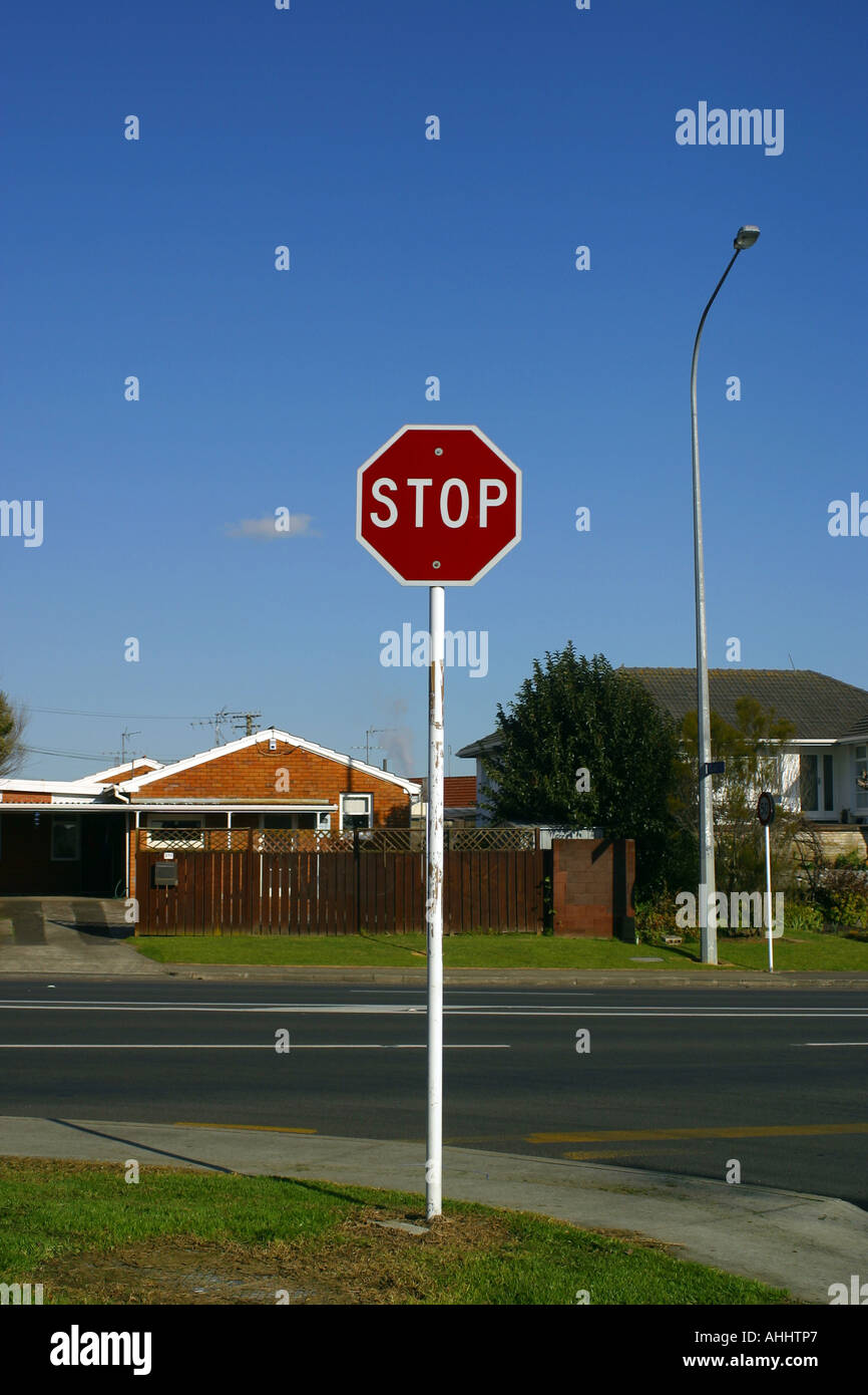 Red stop sign at an intersection Stock Photo - Alamy