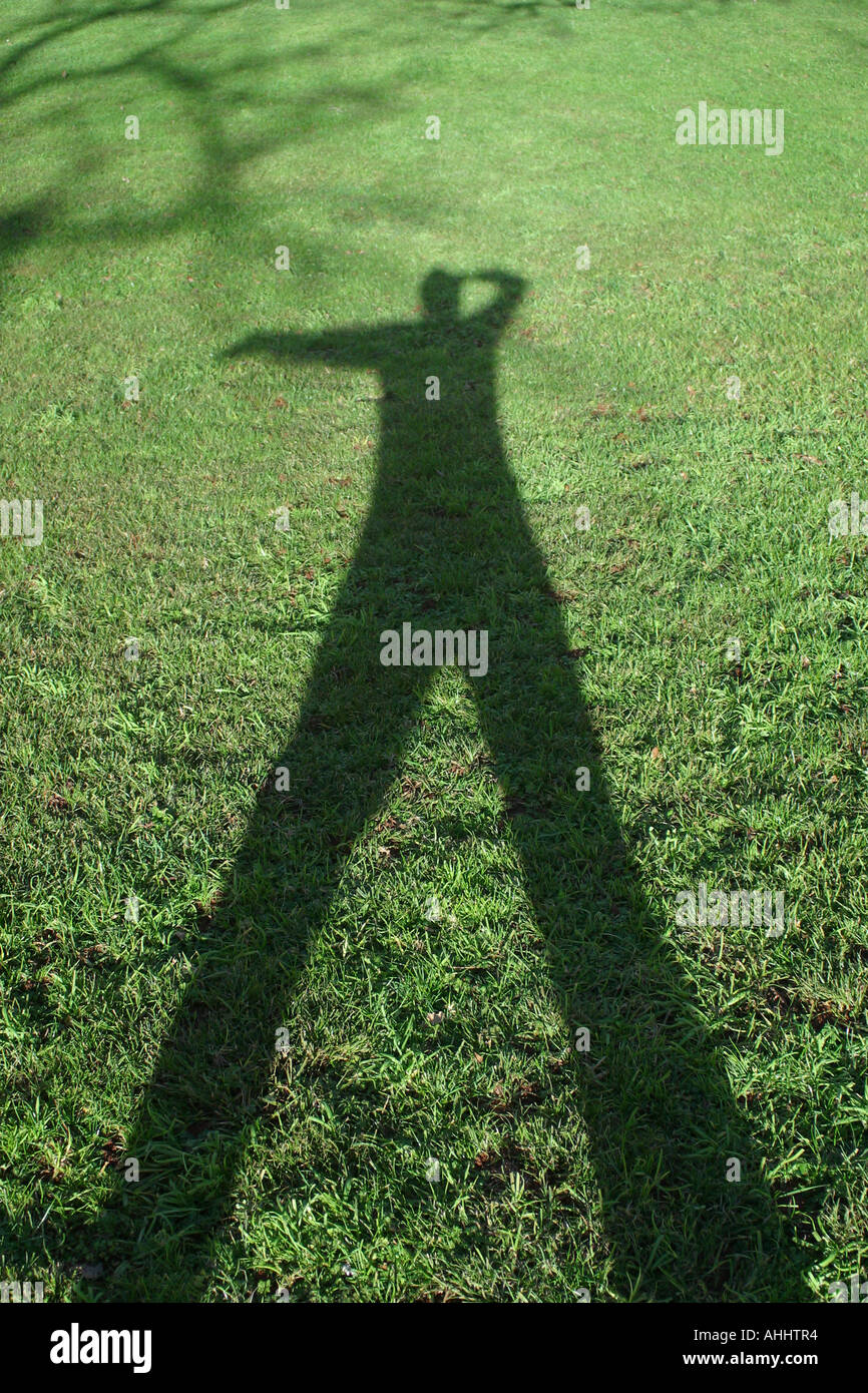 Shadow man in the parkland Stock Photo - Alamy