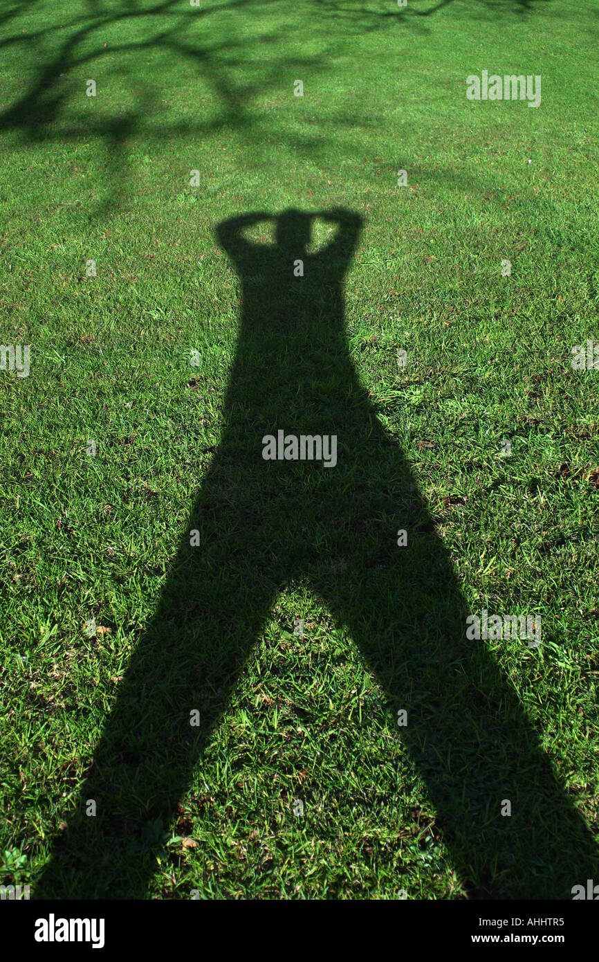 Shadow man in the parkland Stock Photo - Alamy