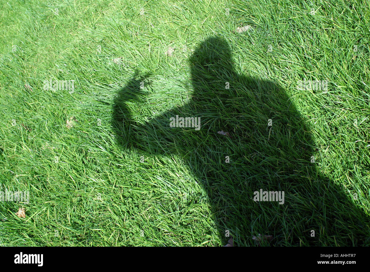 Shadow man in the parkland Stock Photo - Alamy