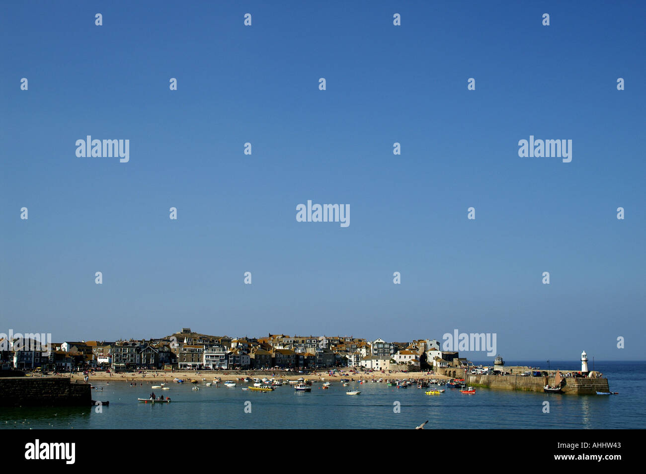The blue sky blue skies harbour and beach St Ives St Ives head Cornwall ...