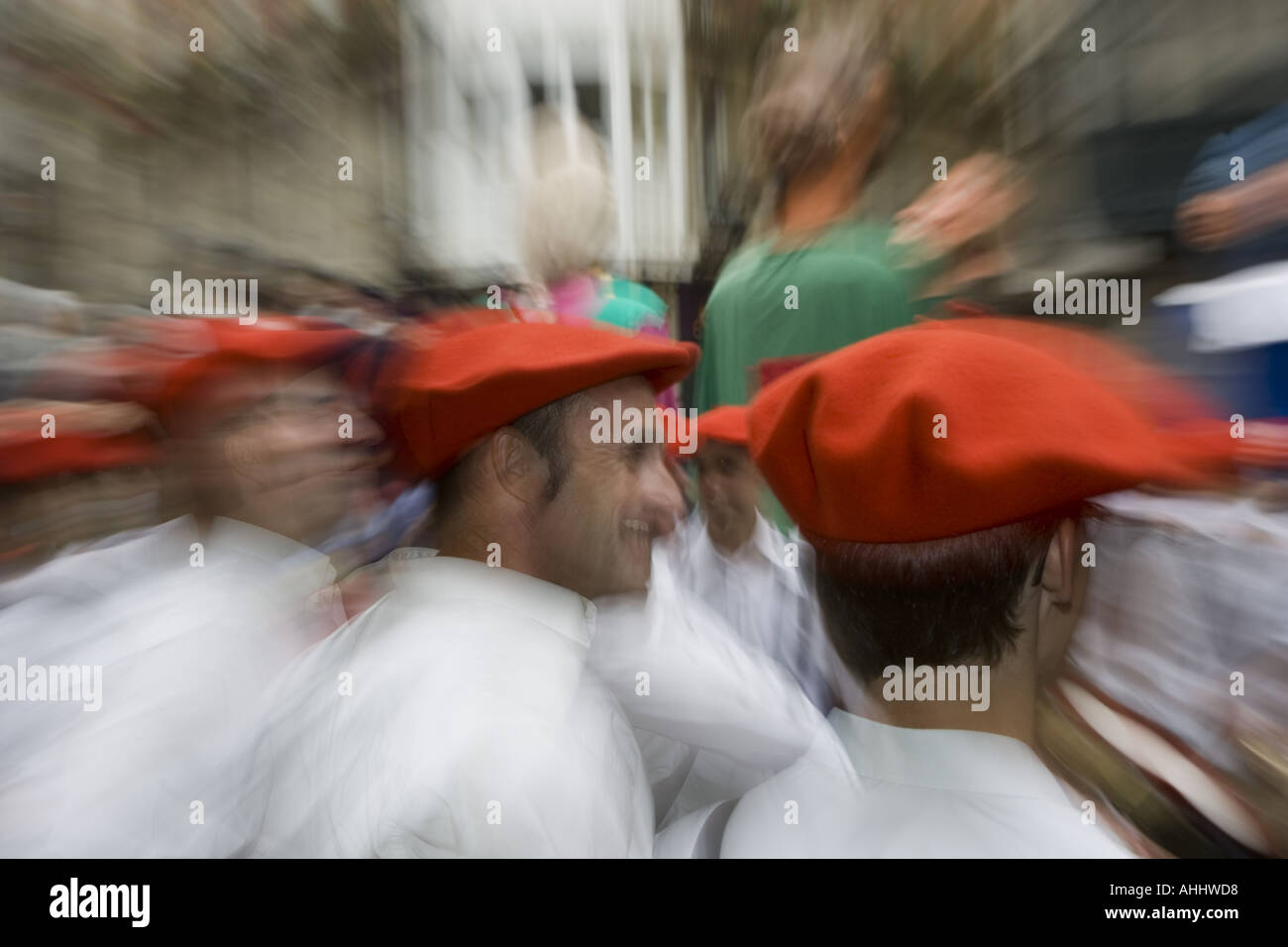 Members of a traditional Basque band wearing red berets parade in ...