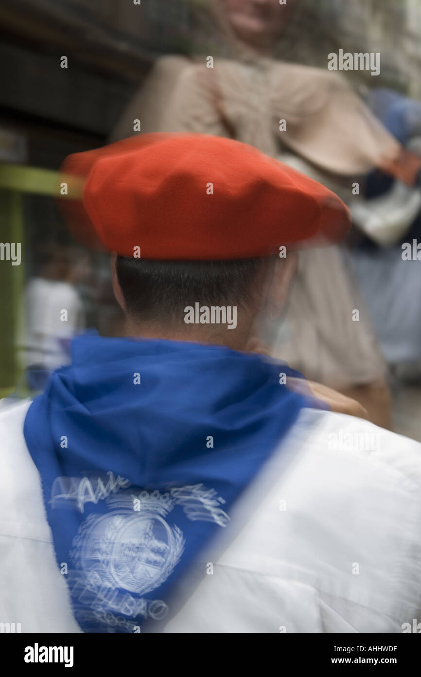 Member of a traditional Basque band wearing red beret parades in Bilbao ...