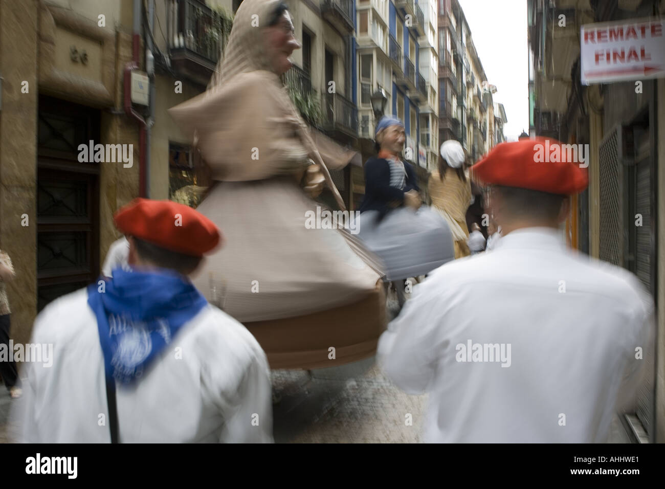 Members of a traditional Basque band follow Gargantua Big Heads through ...