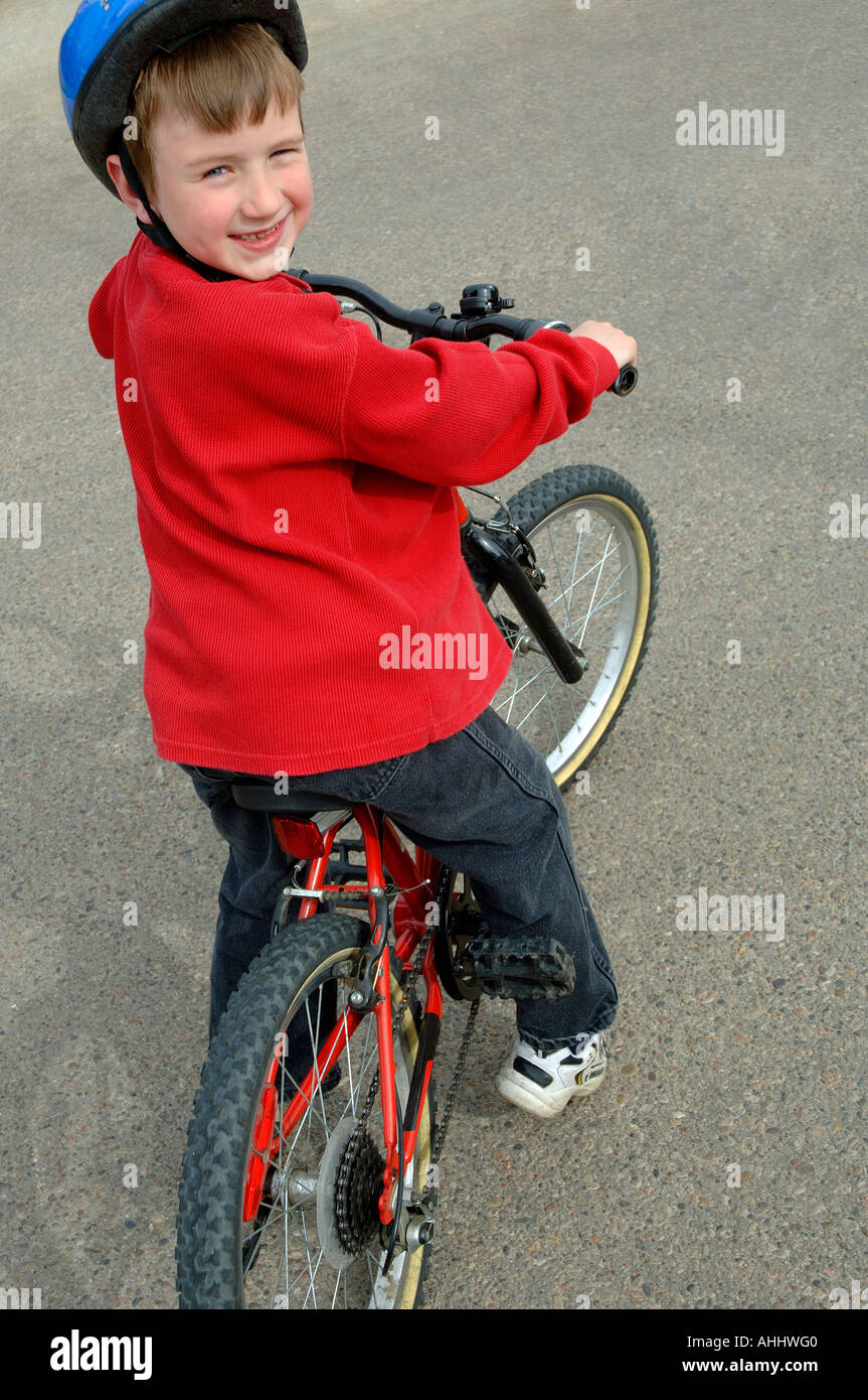 Young boy a bike Stock Photo - Alamy