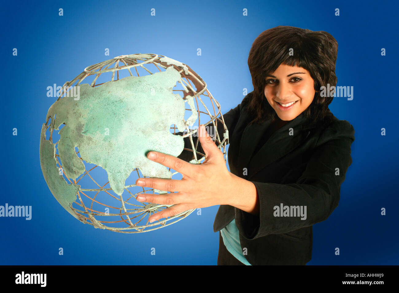Woman holding a wire globe Stock Photo - Alamy