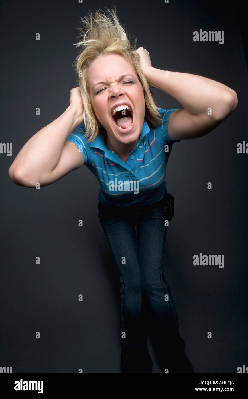 Woman screaming with frustration Stock Photo - Alamy