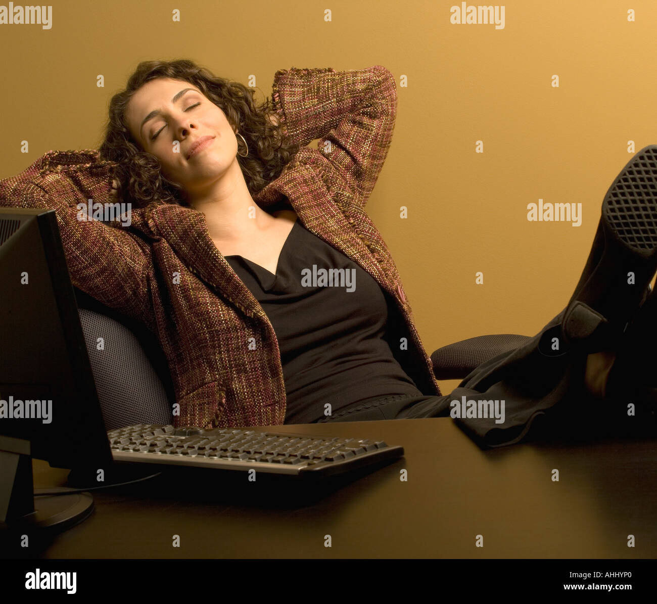Woman resting at her desk Stock Photo - Alamy