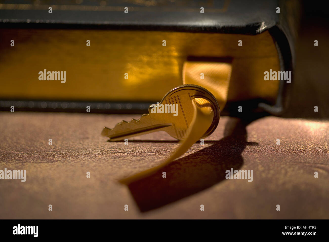 Key with a book Stock Photo - Alamy