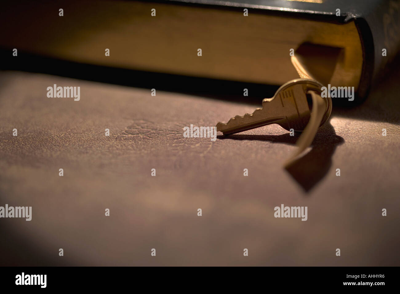 Key with a book Stock Photo - Alamy