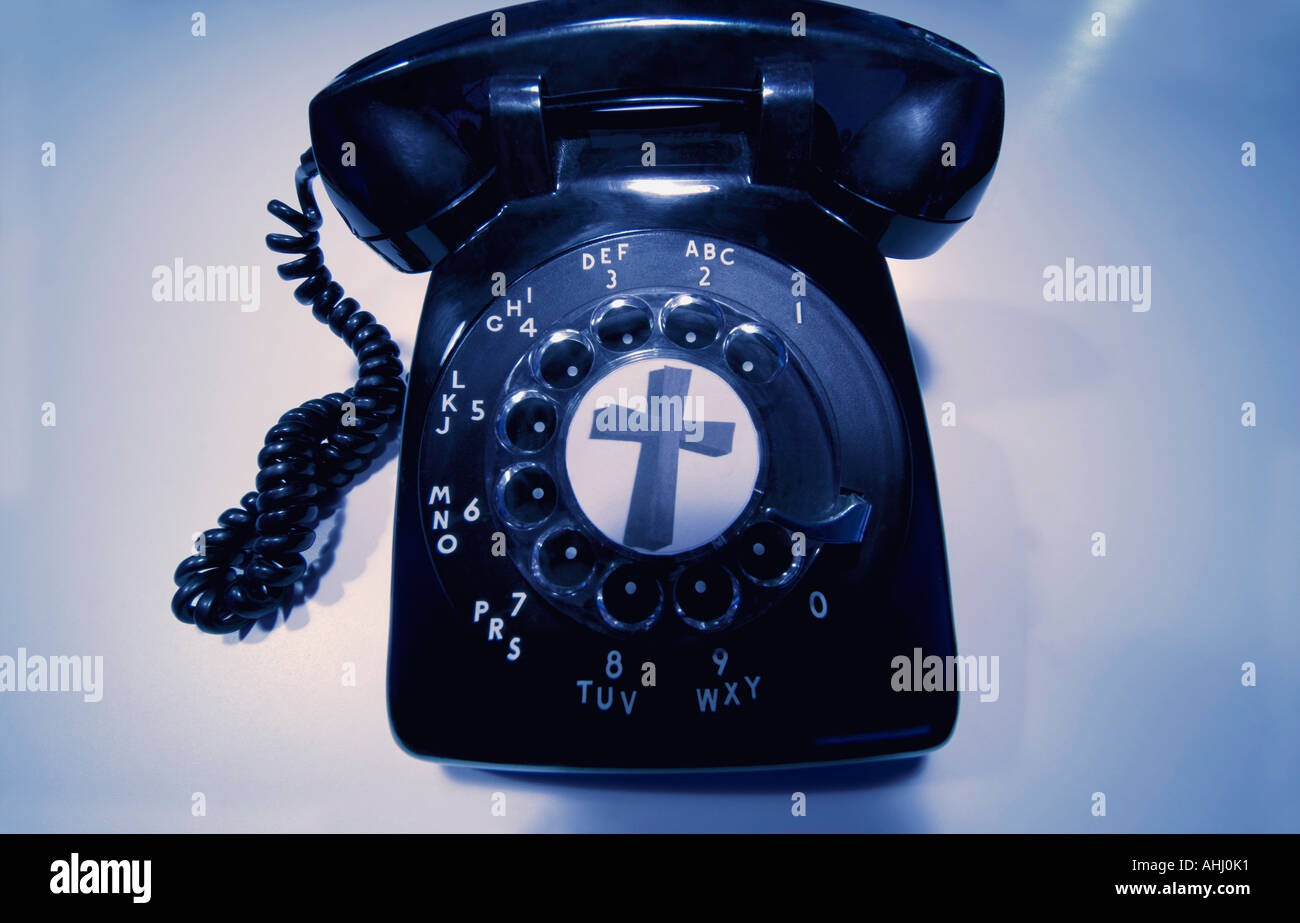 Rotary phone with cross Stock Photo - Alamy
