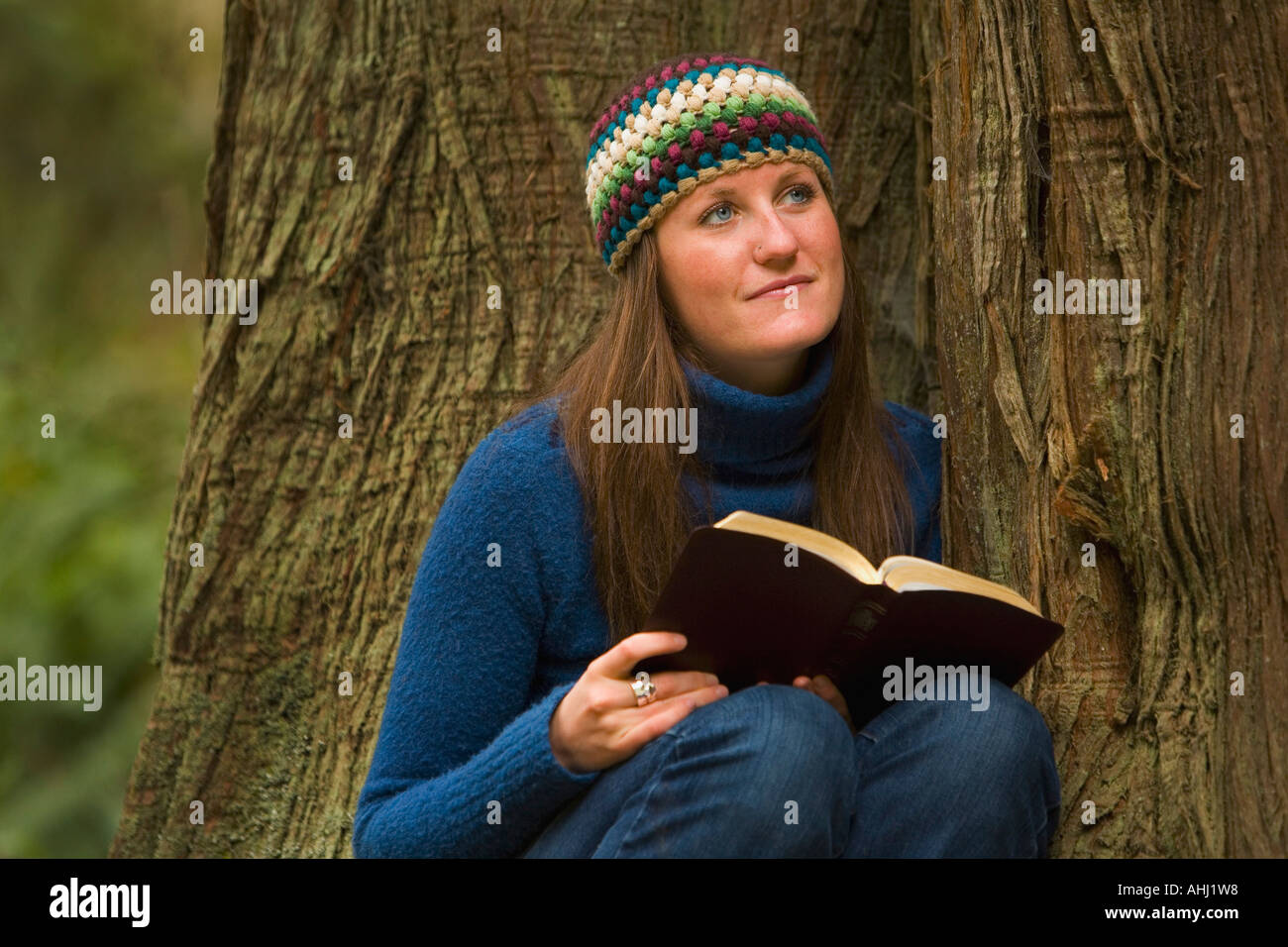 Woman with book Stock Photo - Alamy