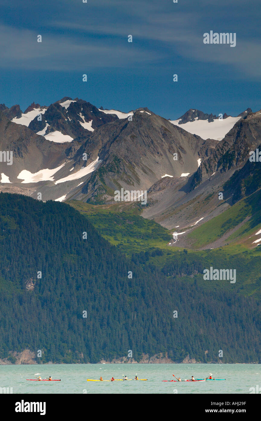 Kayaking in Resurrection Bay with the mountains of Chugach National ...