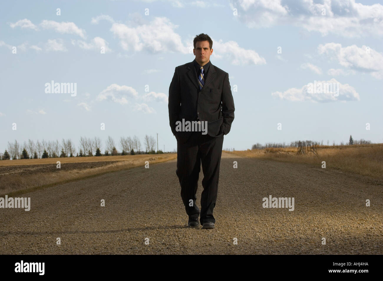 Man walking on road Stock Photo - Alamy