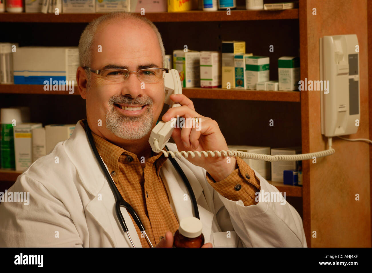 Pharmacist on the phone Stock Photo - Alamy