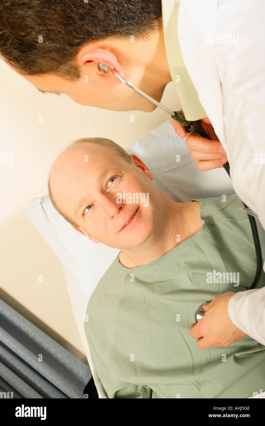 Doctor listening patients heartbeat in hi-res stock photography and ...