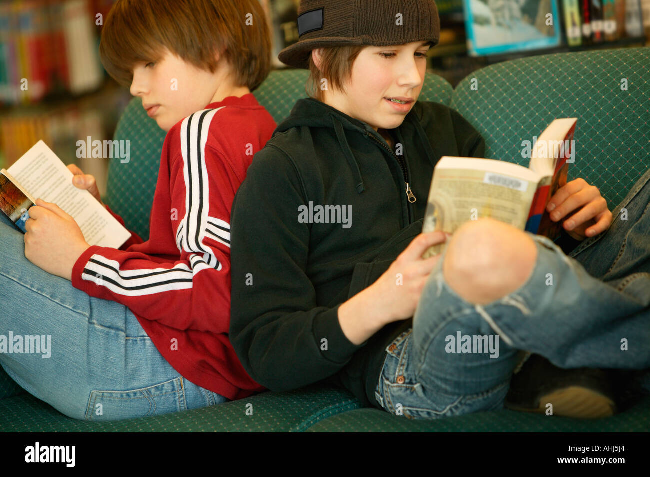 Teenager boy books couch hi-res stock photography and images - Alamy