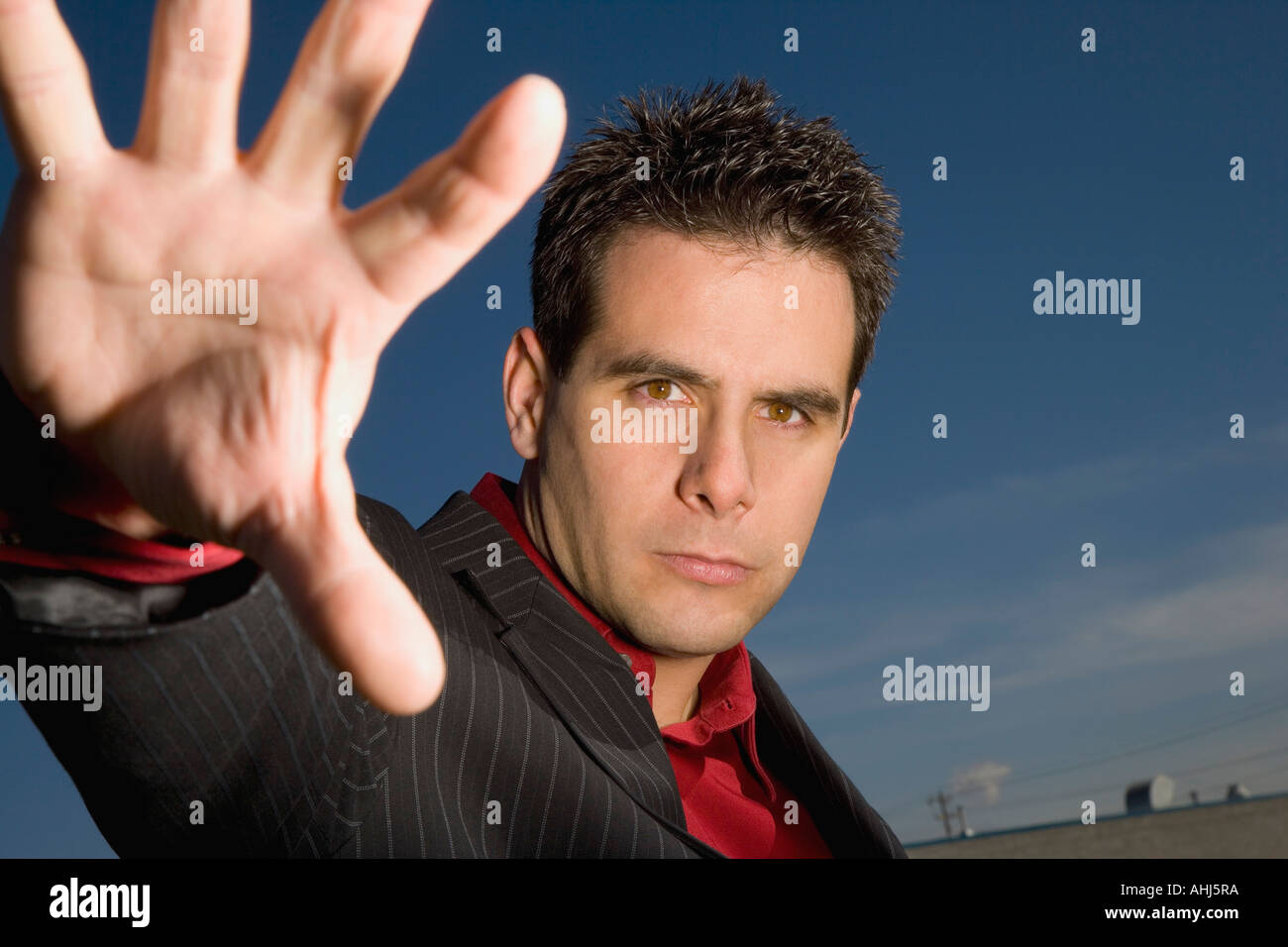 Man with outstretched arm Stock Photo - Alamy