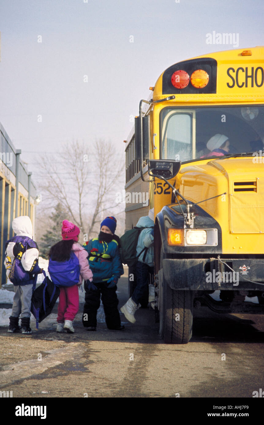 Grade school children boarding school bus St Paul Minnesota Stock Photo ...