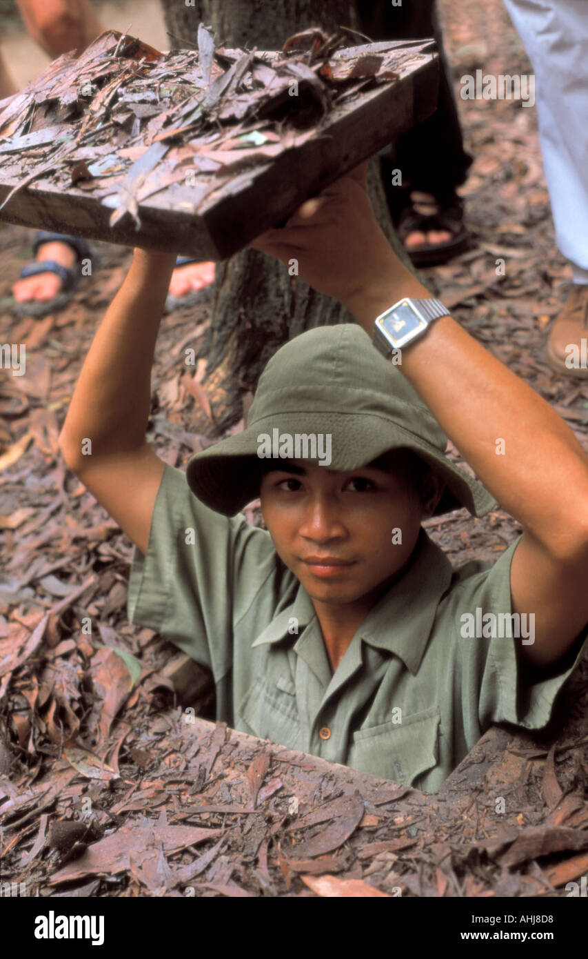 Vietnamese Soldier emerging out of the Cu Chi tunnels near Ho Chi Minh ...