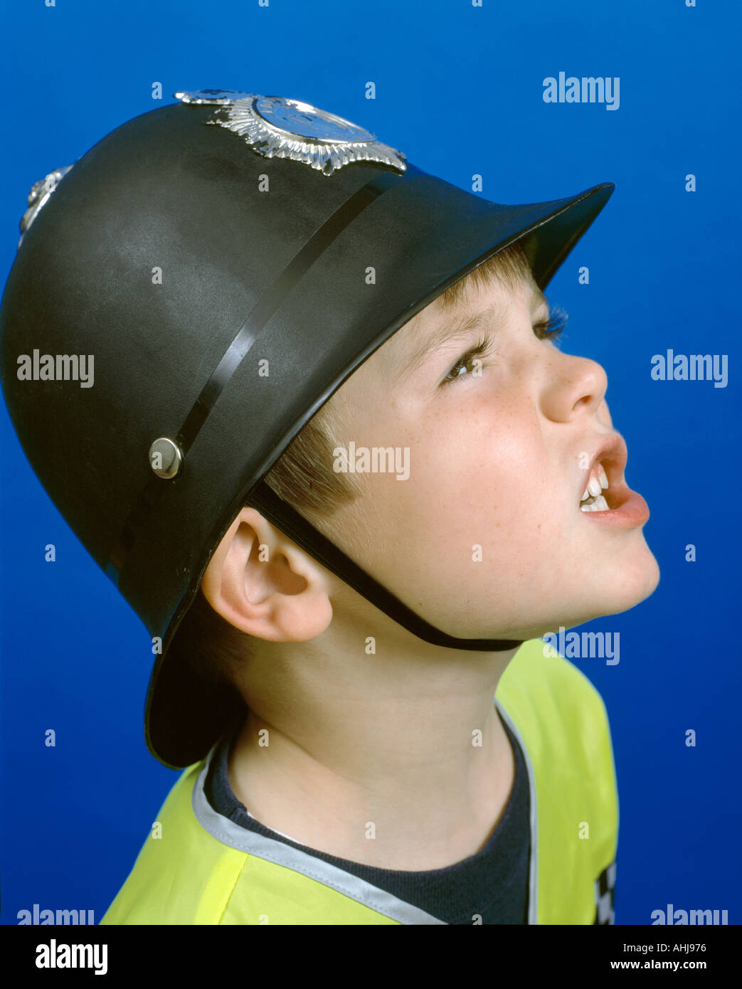 Young boy child wearing dressing up clothes Caucasian white policeman ...