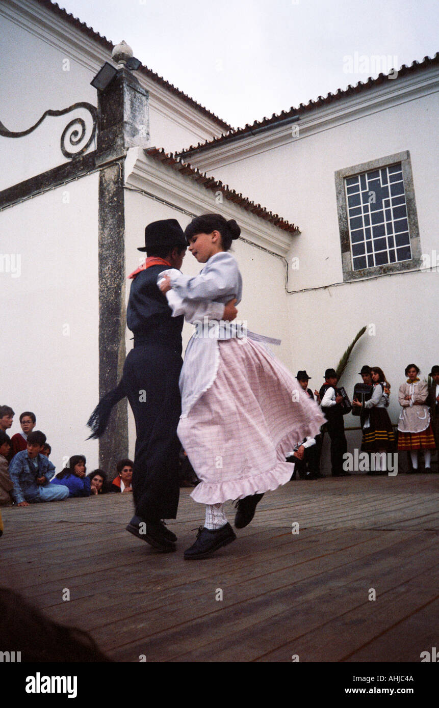Children performing traditional dance in traditional dress on outdoor ...