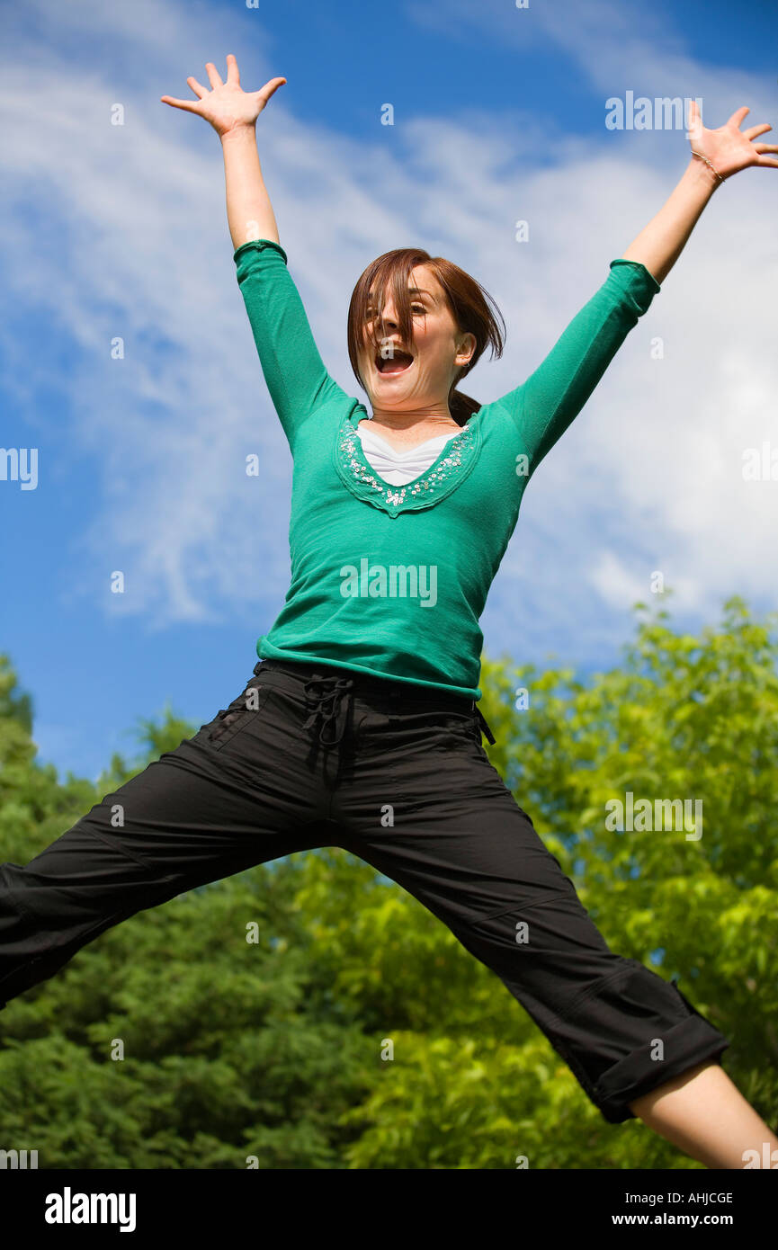 Girl jumping for joy Stock Photo - Alamy