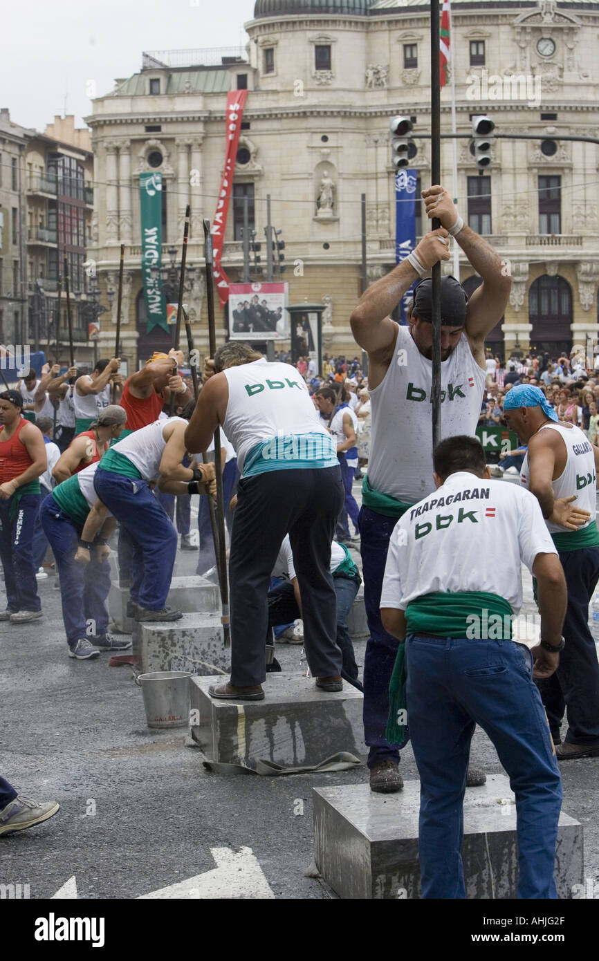 Teams of Basque men compete to chip through blocks of granite during ...