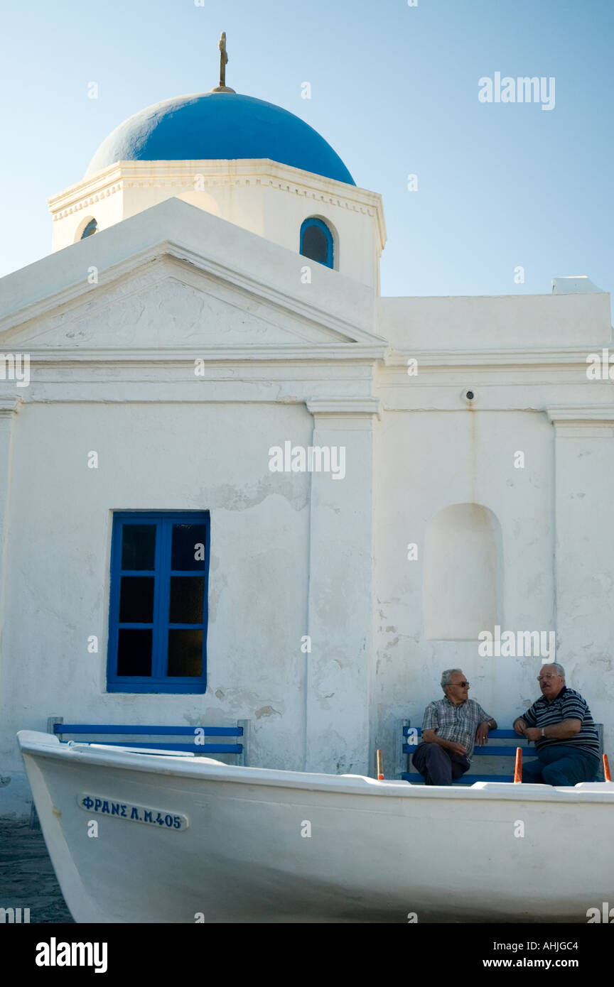 Boat, church and local men in Mykonos Town Mykonos The Cyclades Greek ...