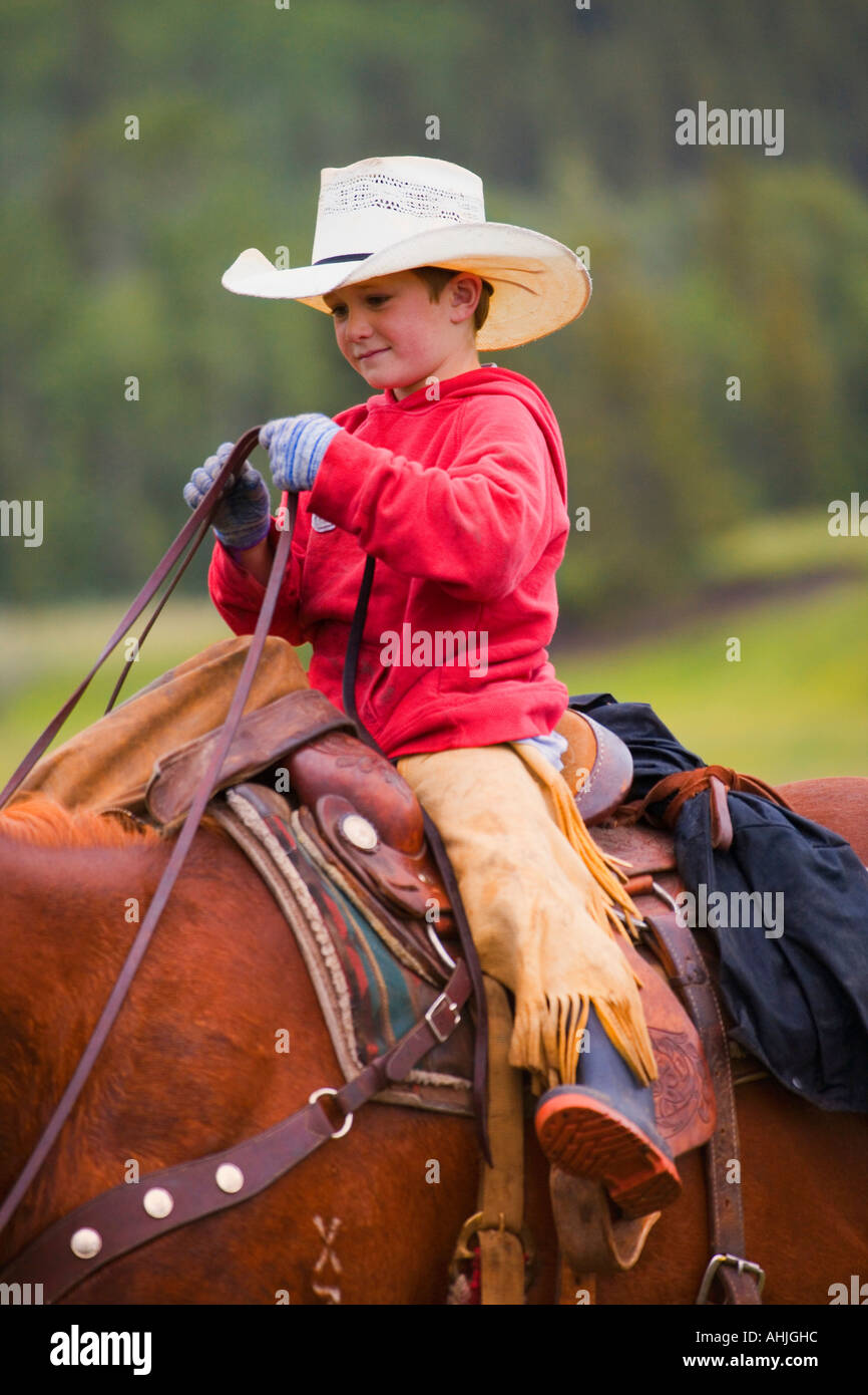 Young cowboy on horse Stock Photo - Alamy