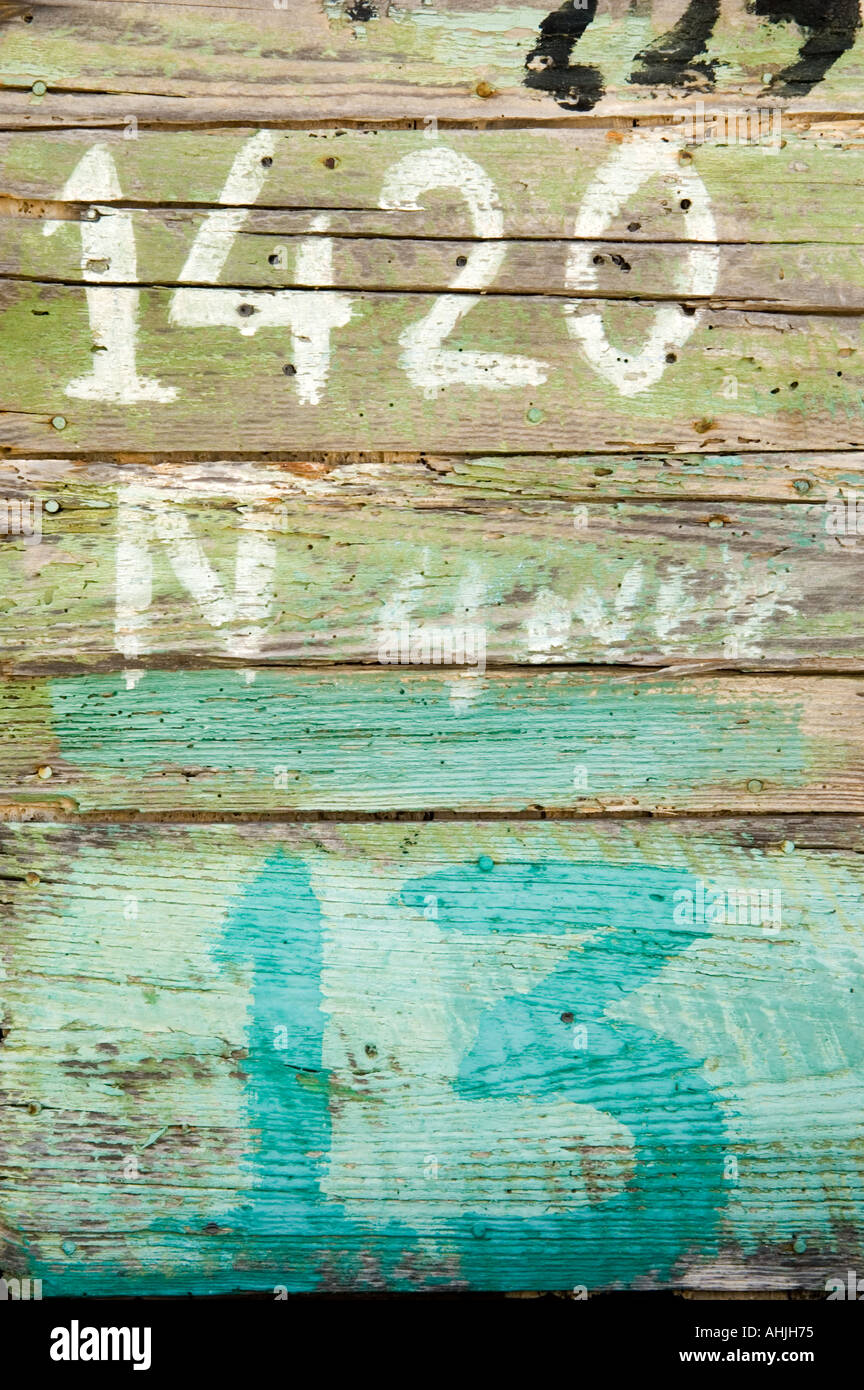 colorful hand painted numbers on old wooden gate door house building ...