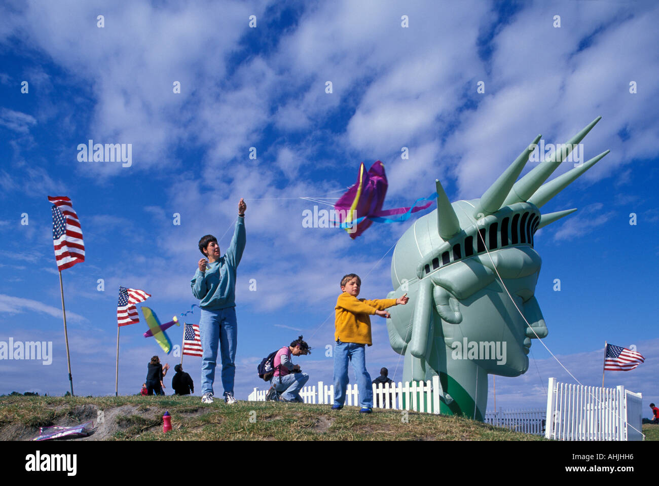 USA Washington Seattle Family flies kite by inflated Statue of Liberty ...
