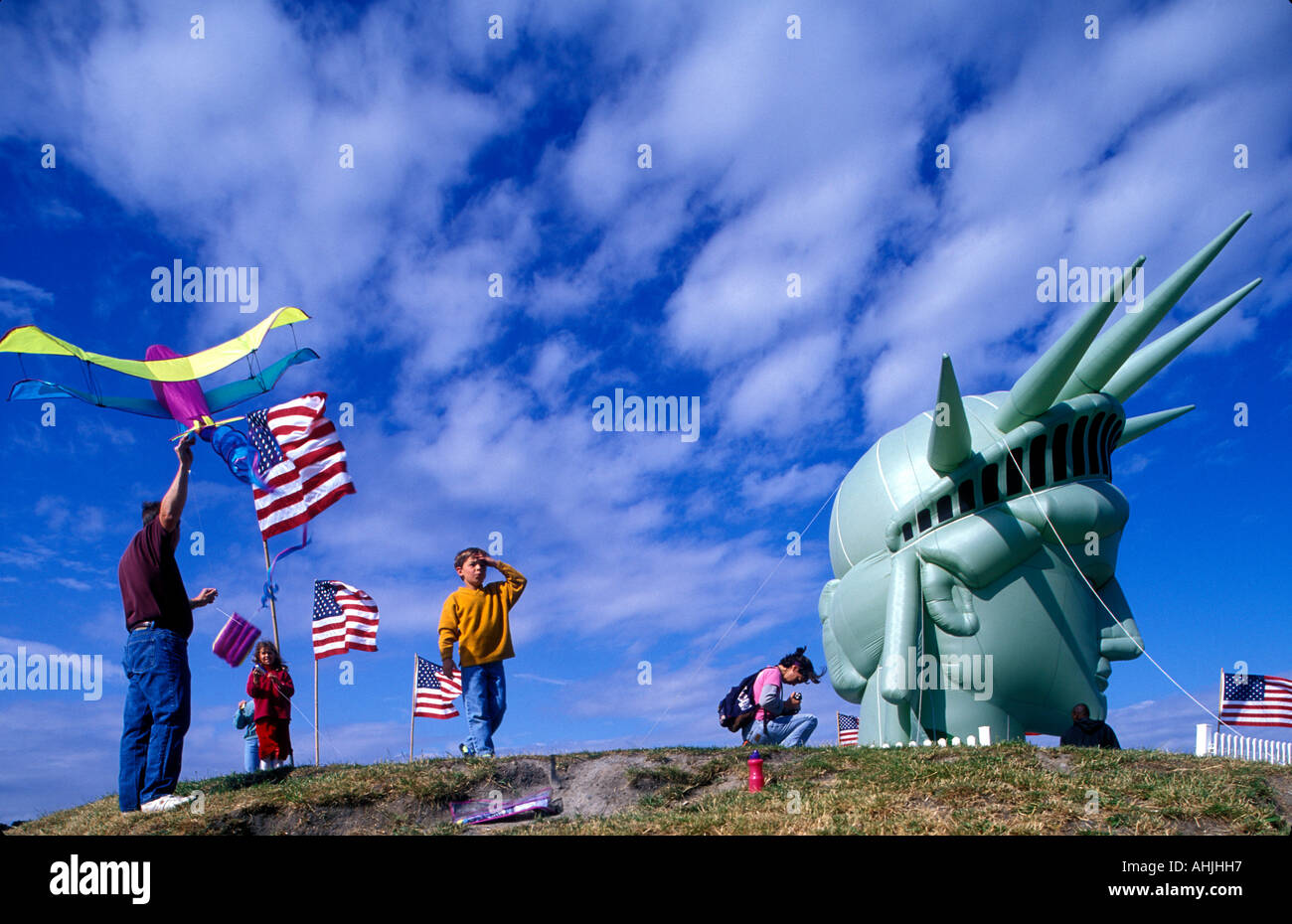 USA Washington Seattle Family flies kite by inflated Statue of Liberty ...