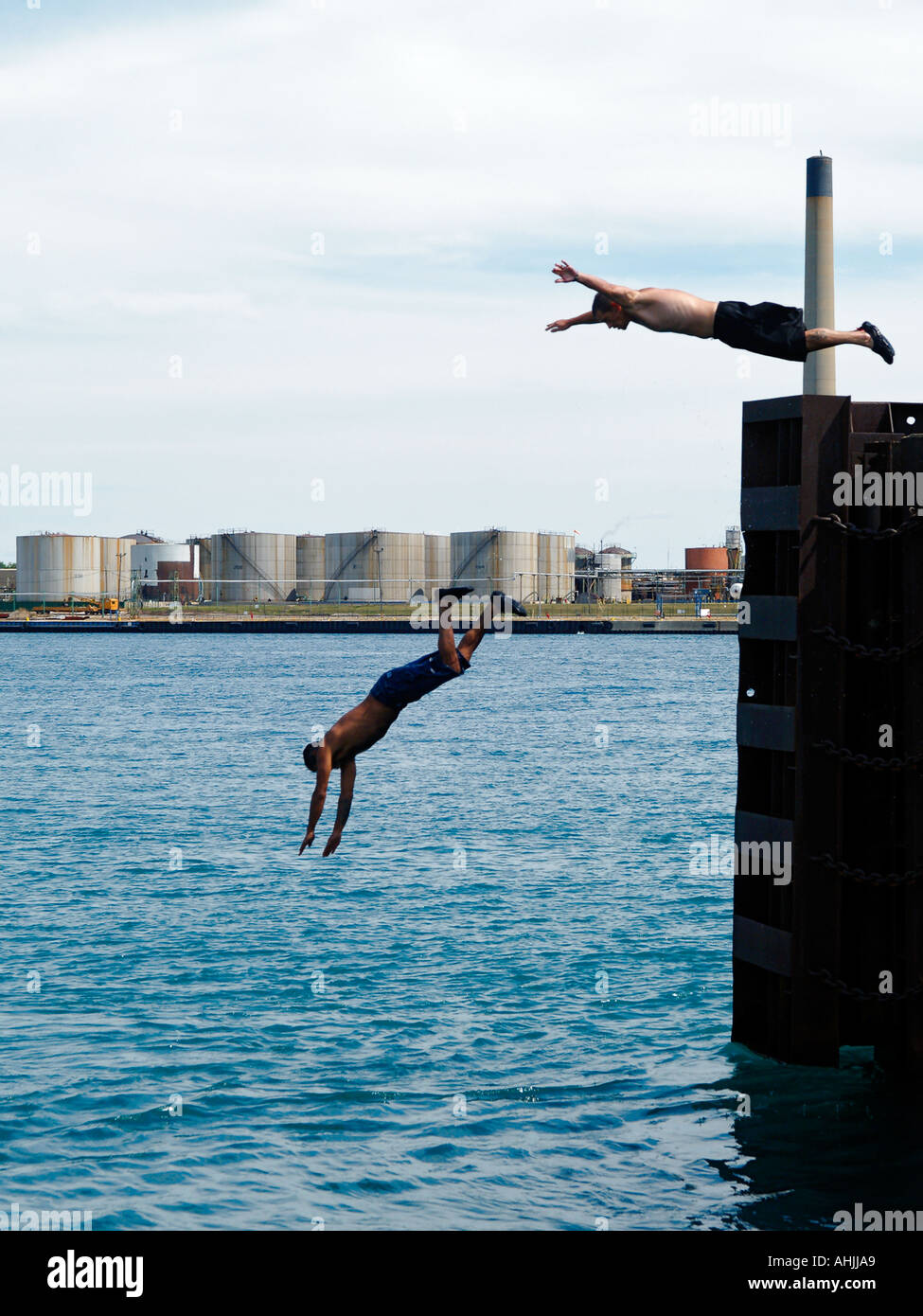 Young men diving off of the old piers at the Port Huron Seaway Terminal ...