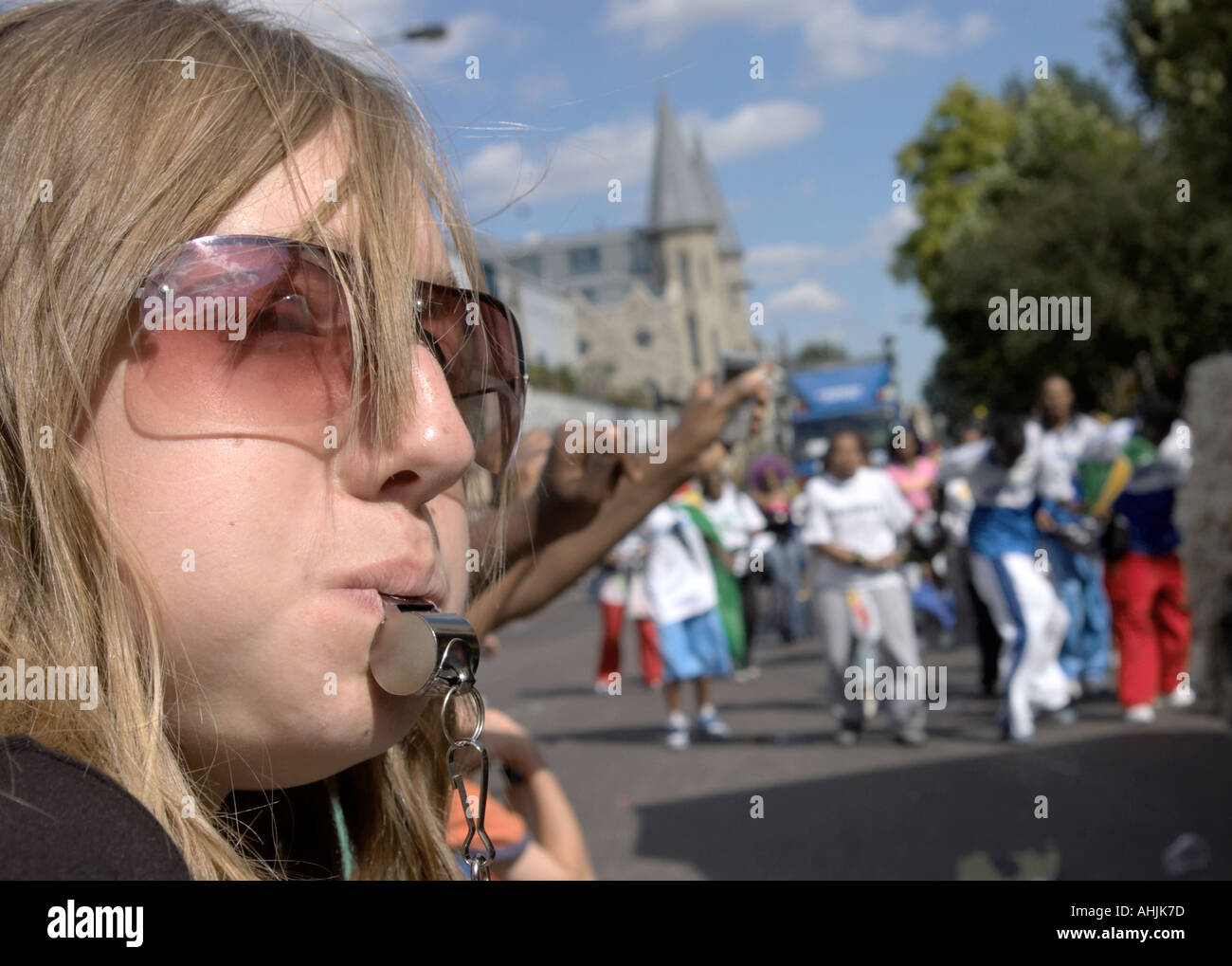 girl at Notting Hill Carnival blowing a whistle Stock Photo - Alamy